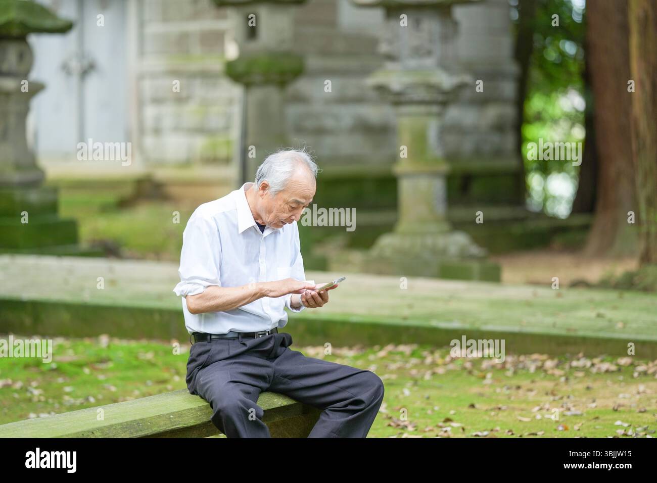 In rural Japan, a Japanese man in his late 70s sits at a peaceful ...
