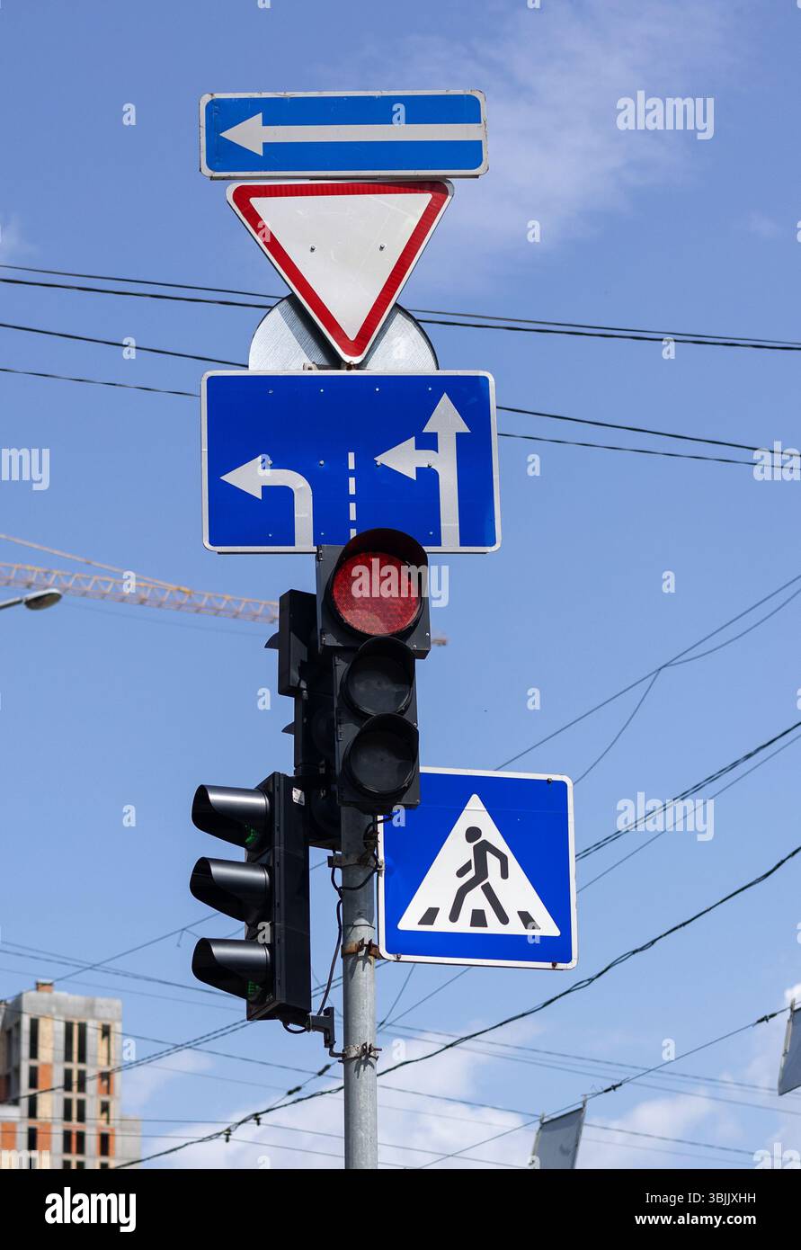 Traffic light with different signs Stock Photo - Alamy
