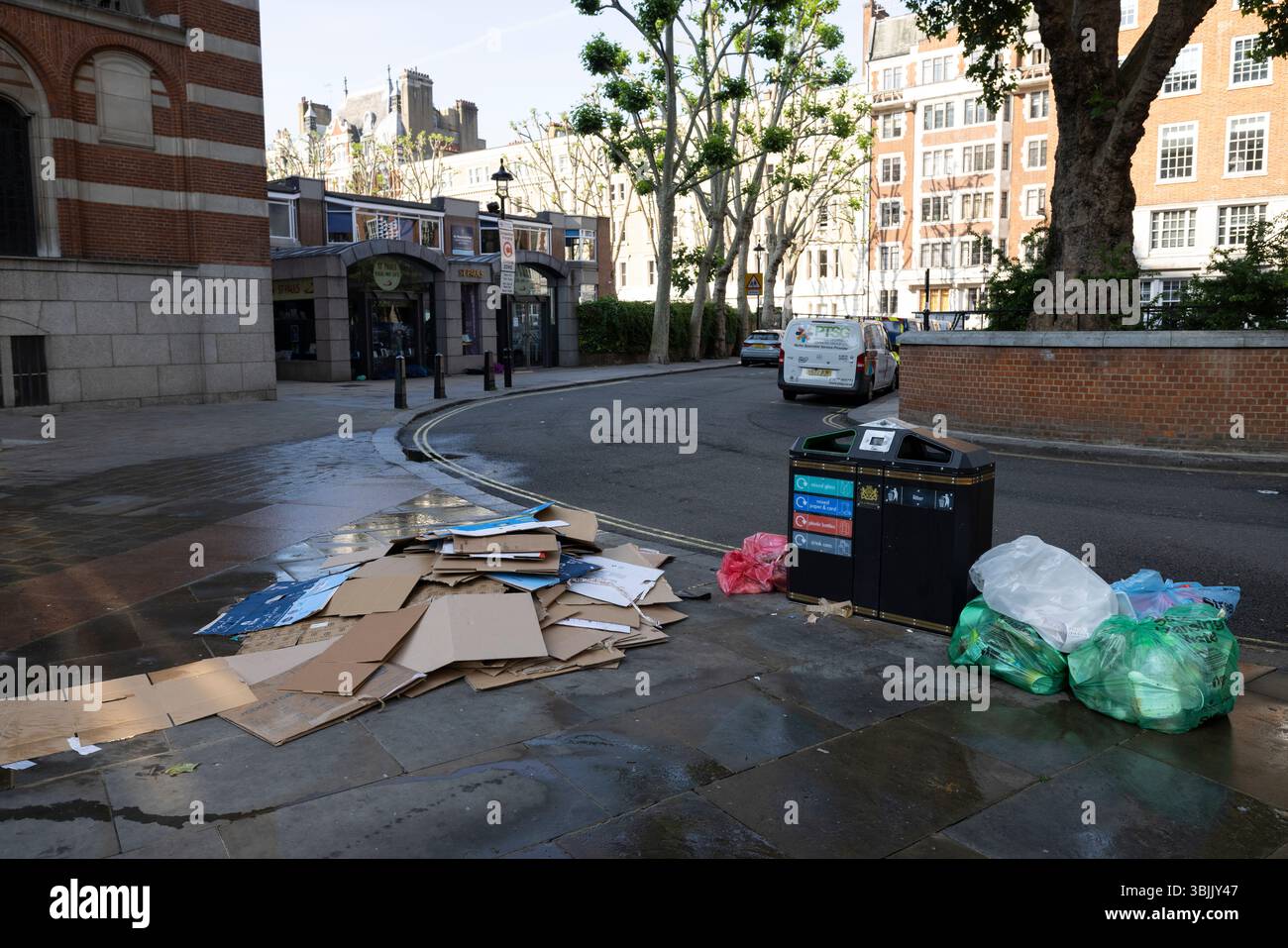 Pile of rubbish waiting to be collected in Victoria, central London ...