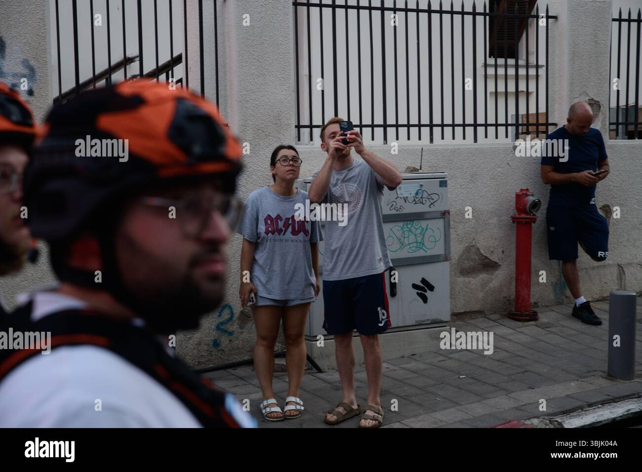 Israelis take photos of civilian houses that were destroyed by a direct ...