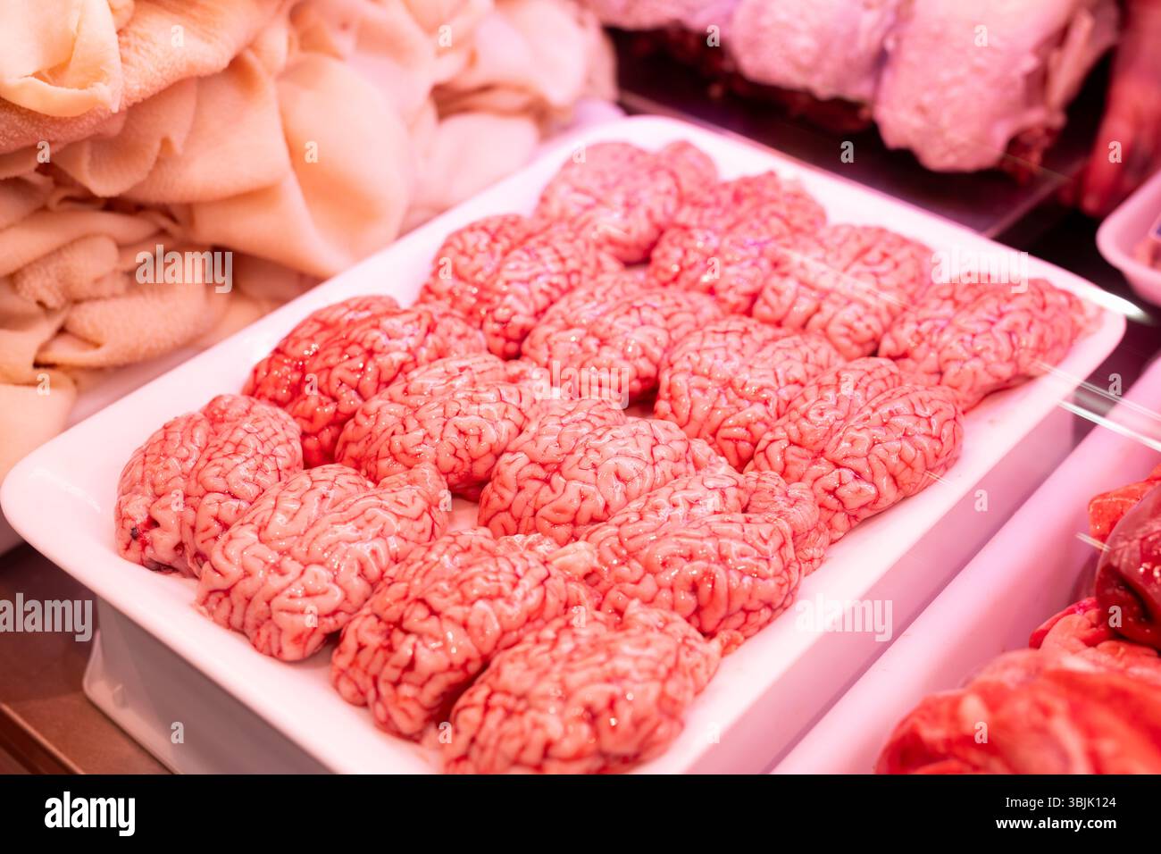 Raw sheep brains on counter of butcher shop Stock Photo - Alamy