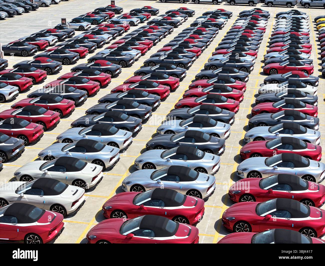 Aerial of new cars waiting for shipment at a sea port in Lianyungang ...