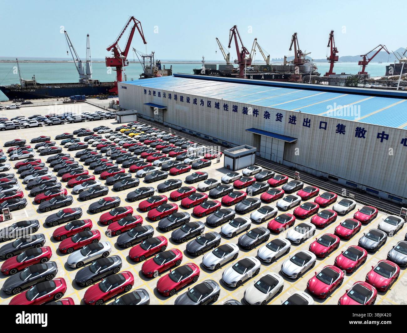 Aerial of new cars waiting for shipment at a sea port in Lianyungang ...