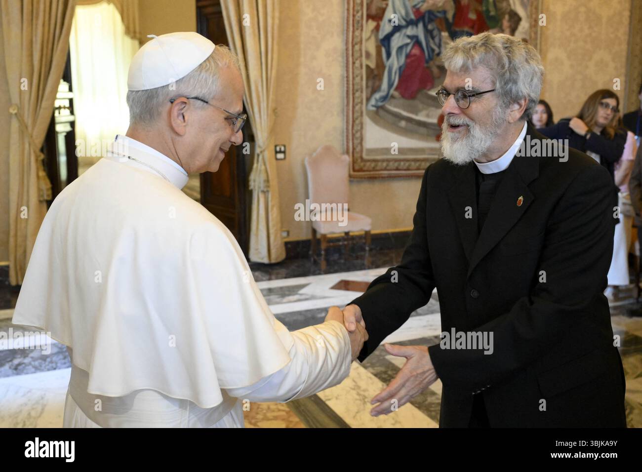 Vatican. 16th June, 2025. Pope Leo XIV shakes hands with Brother Guy ...