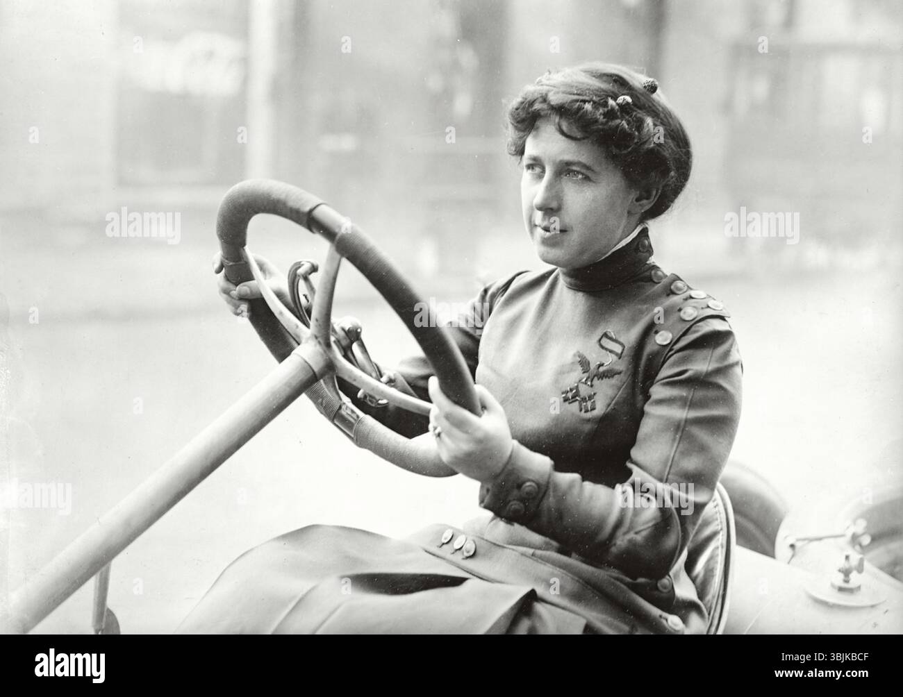 Race car driver Joan Newton Cuneo, seated in racing car. Date: circa ...