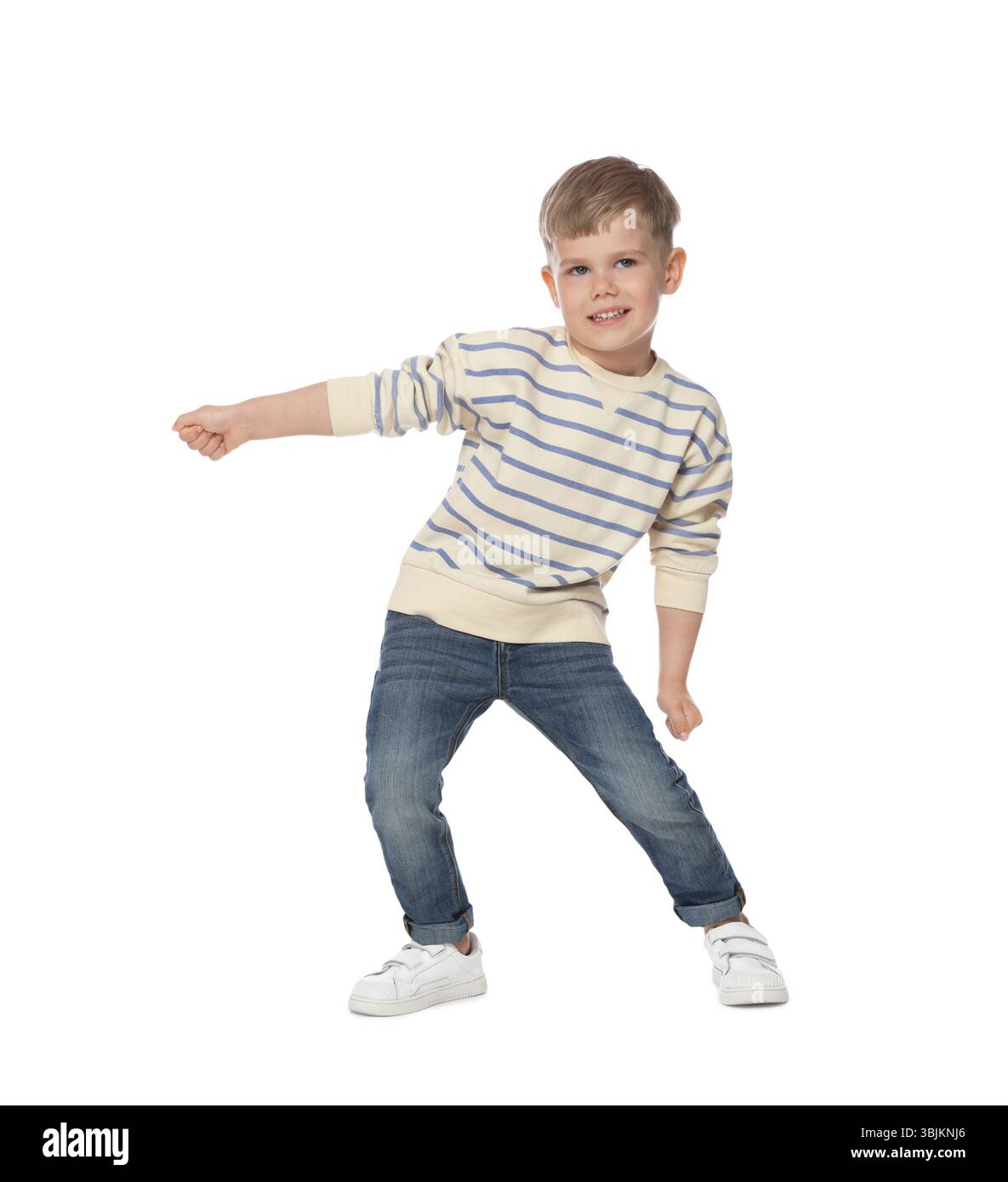 Happy little boy dancing on white background Stock Photo - Alamy