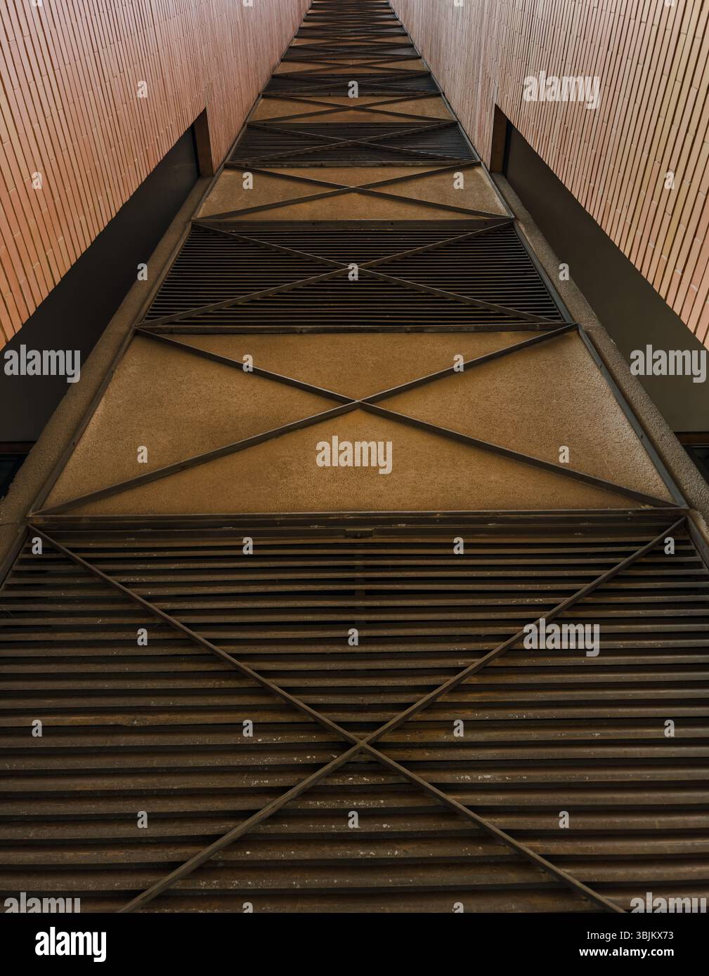 A striking upward view of a modern architectural corridor featuring ...