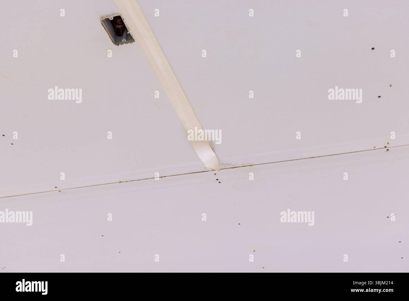 Details of ceiling are visible, highlighting joints appears unfinished ...