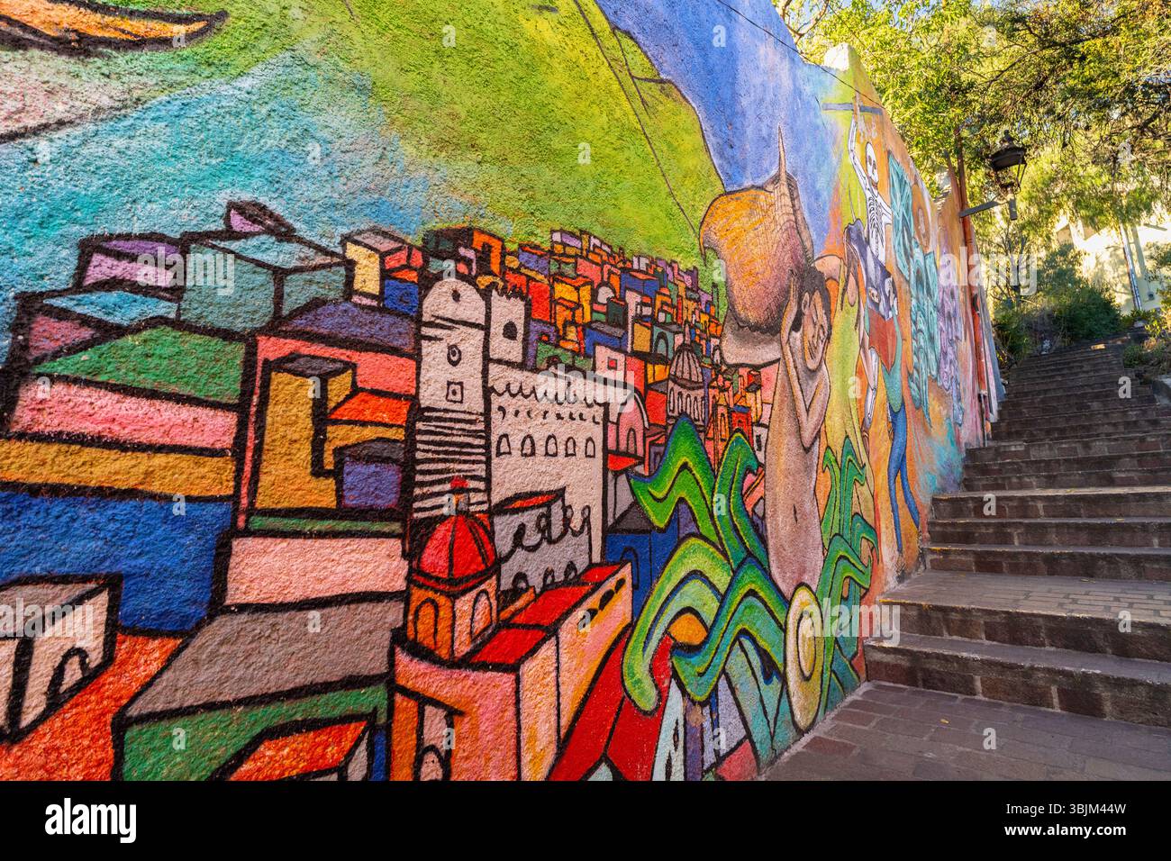 Community murals painted on the walls of homes on the steep pedestrian ...