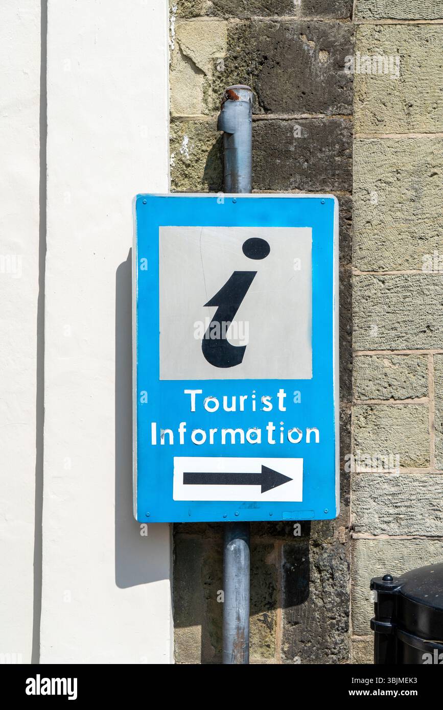 Tourist information sign with peeling letters Stock Photo - Alamy
