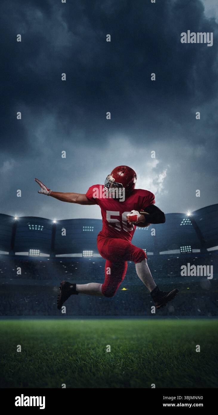 American football running back in red uniform jumping with ball during ...