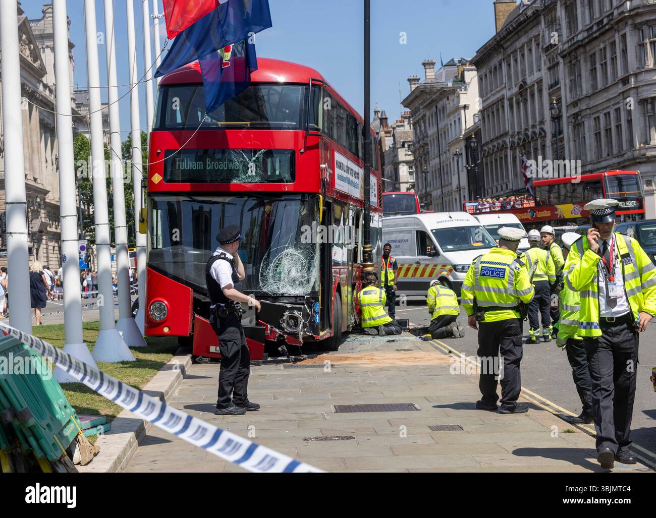 London, UK. 16th June, 2025. A number 11 Double decker bus crashes into a lamppost and flagpoles ...