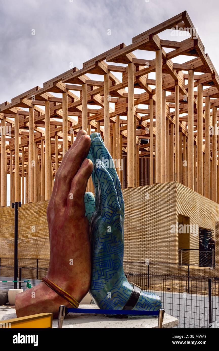 giant monument of hands touching together in prayer at the India ...