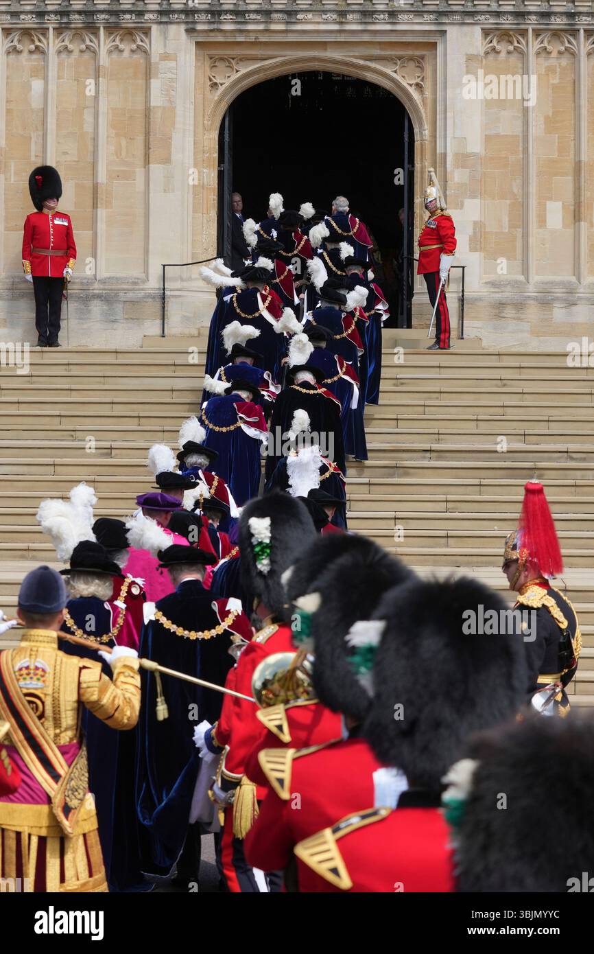 Members of the Most Noble Order of the Garter, walk up the steps to St ...