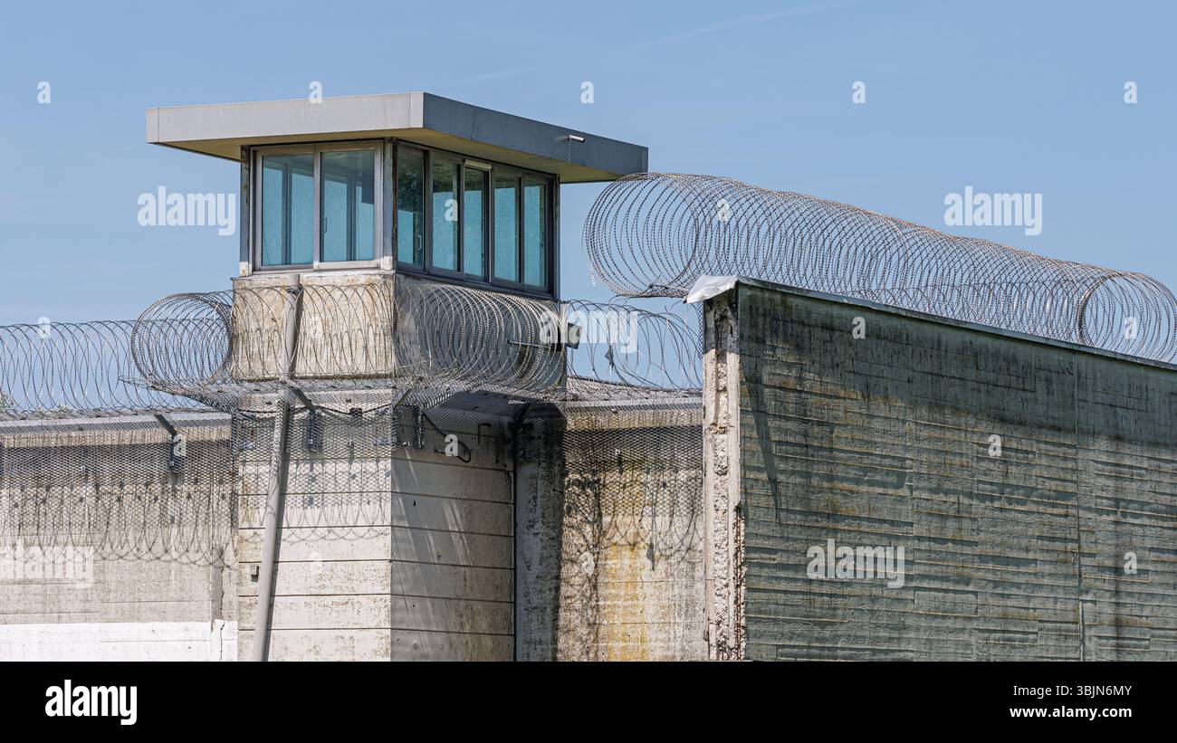 Hamburg, Germany. 13th June, 2025. A prison wall with a watchtower and ...