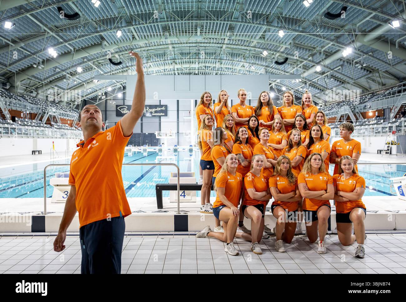 EINDHOVEN - A group photo of the Dutch water polo players and coach ...