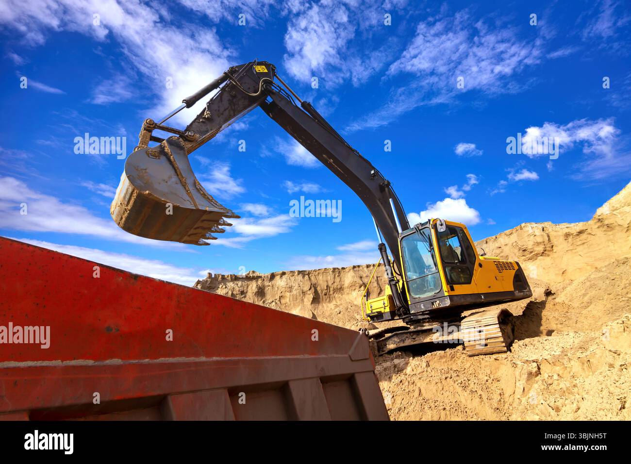 Excavator Loading Dumper Truck extreme wide-angle Stock Photo - Alamy