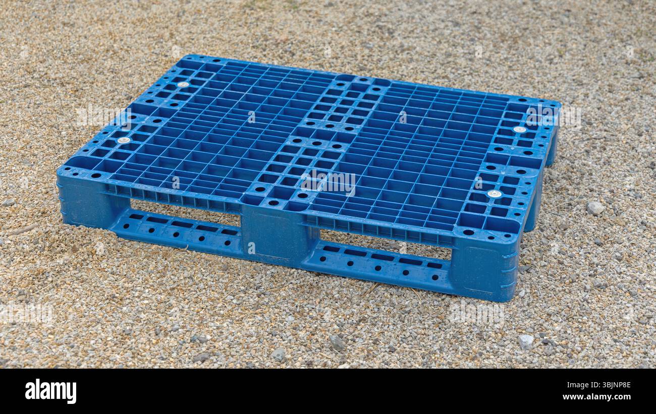 Blue Plastic Euro Standard Cargo Pallet at Gravel Stock Photo - Alamy