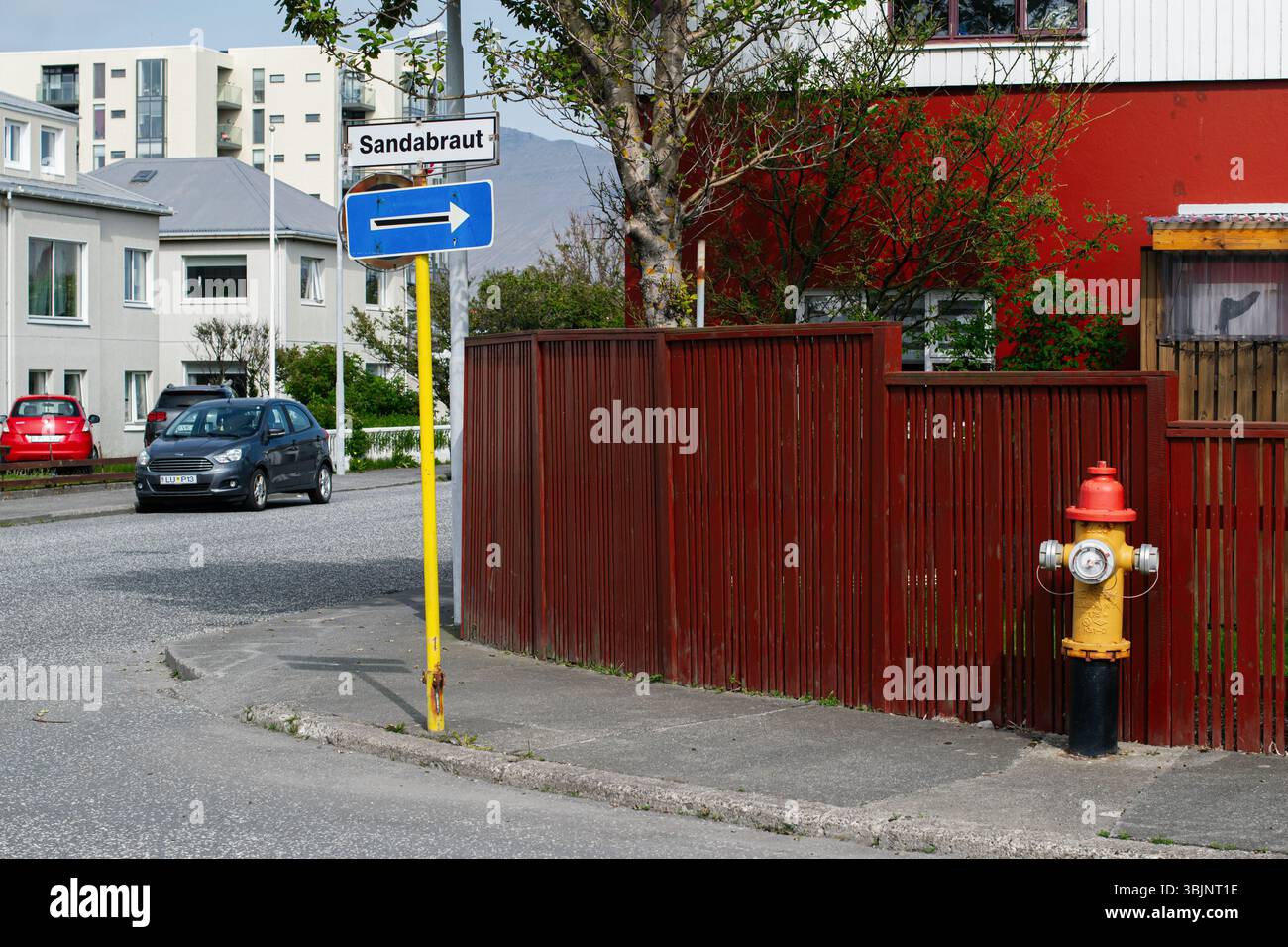 Akranes, Iceland - June 15, 2025: Urban street scene with red fire ...