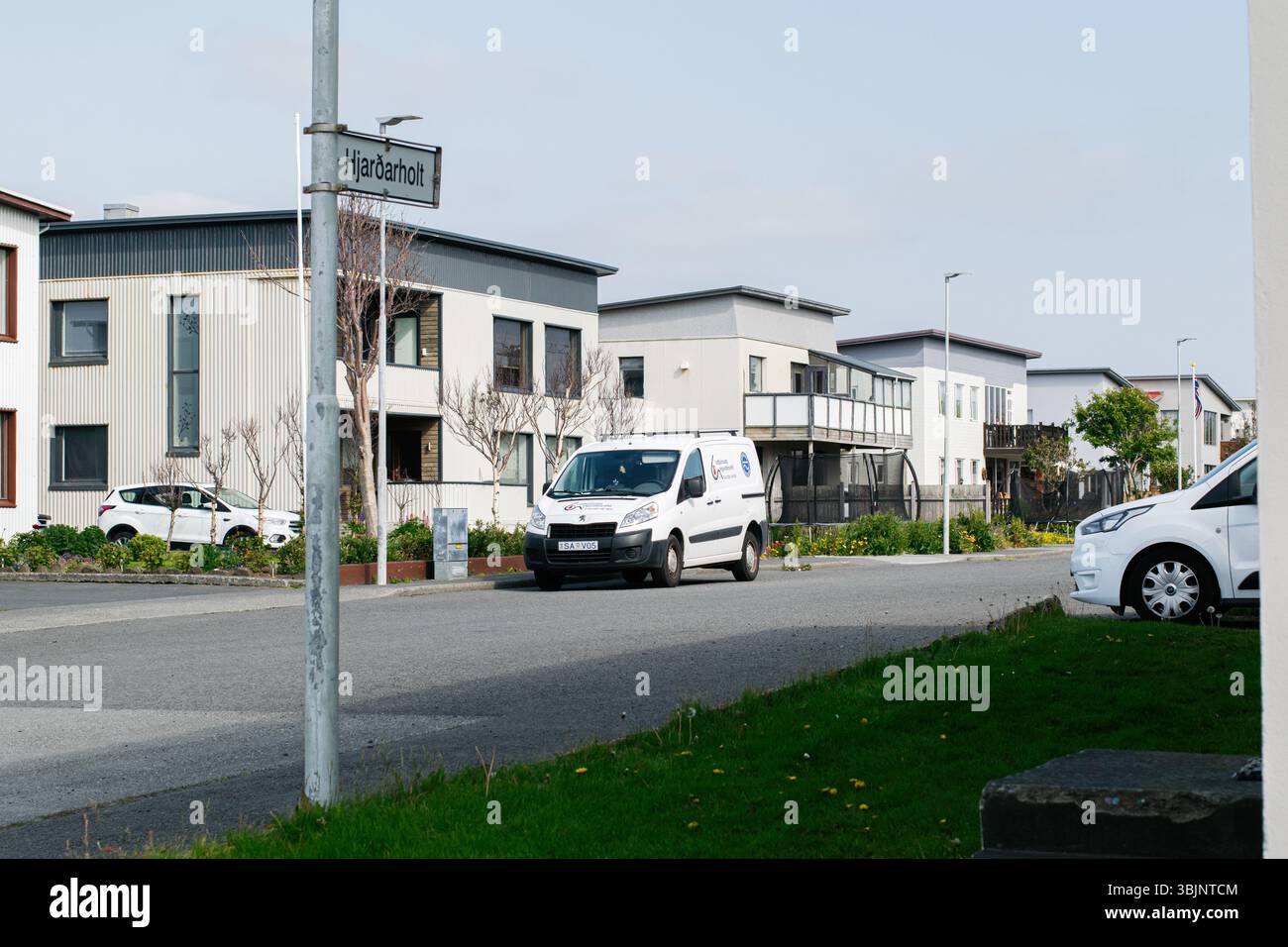 Akranes, Iceland - June 15, 2025: Modern housing and vehicles in a ...