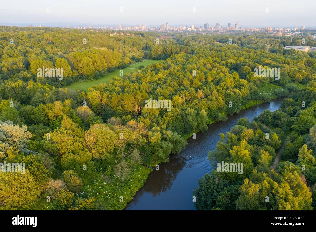 Aerial image over Philips Park featuring river Irwell and Manchester ...