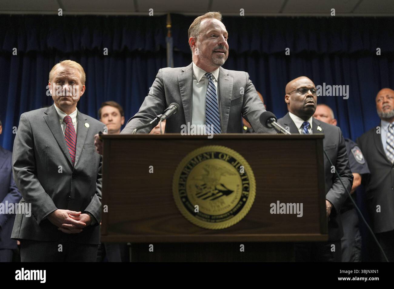 Acting U.S. Attorney Joseph H. Thompson speaks during a news conference ...