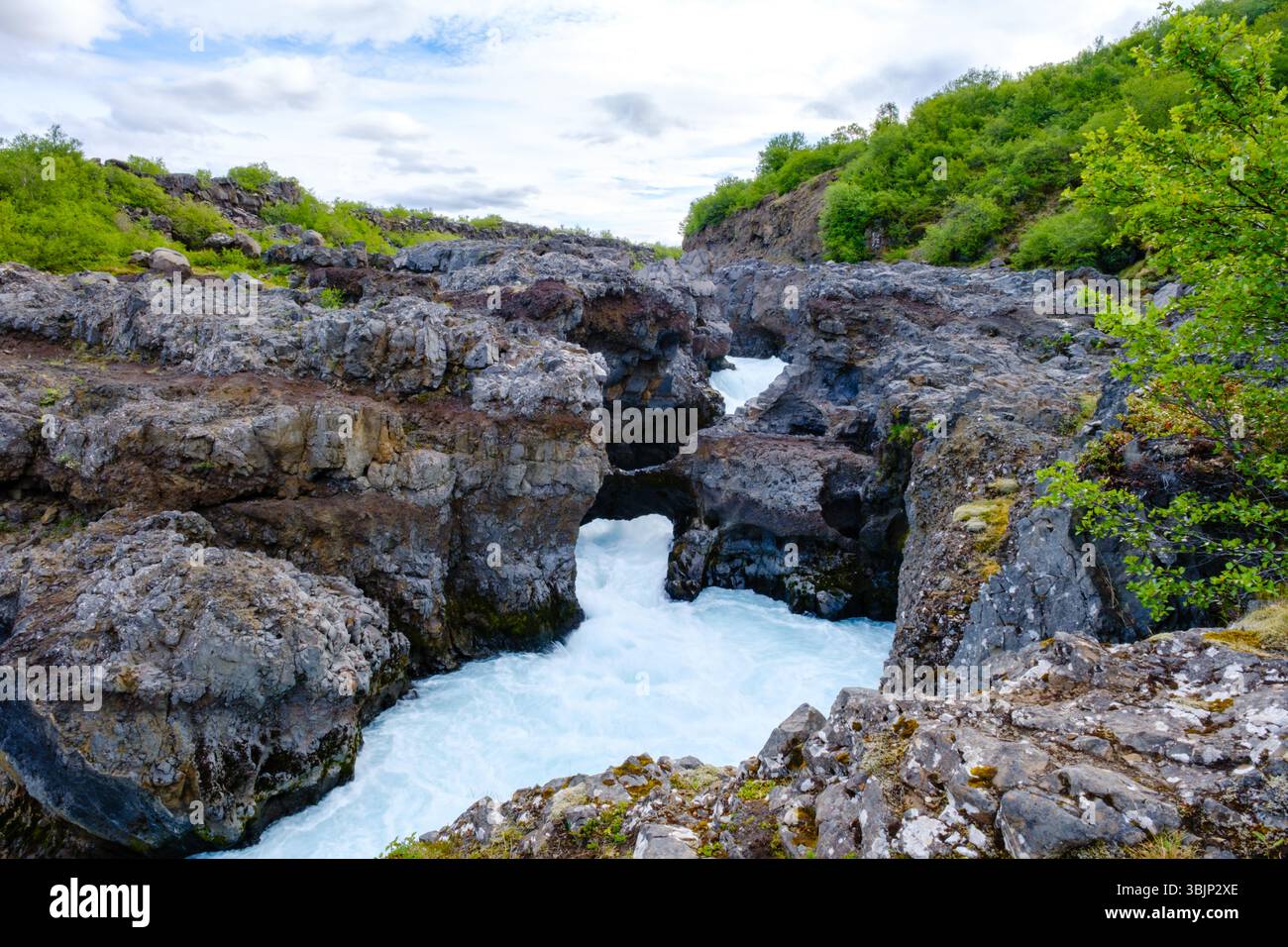 Stunning waterfalls cascade through rocky formations at Barnafoss and ...