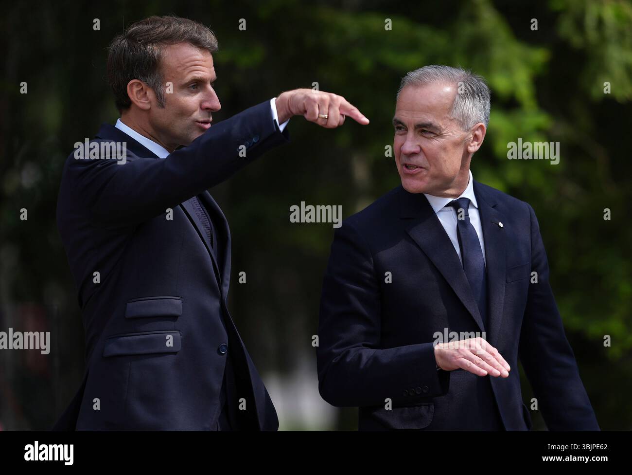 French President Emmanuel Macron, left, and Canadian Prime Minister ...