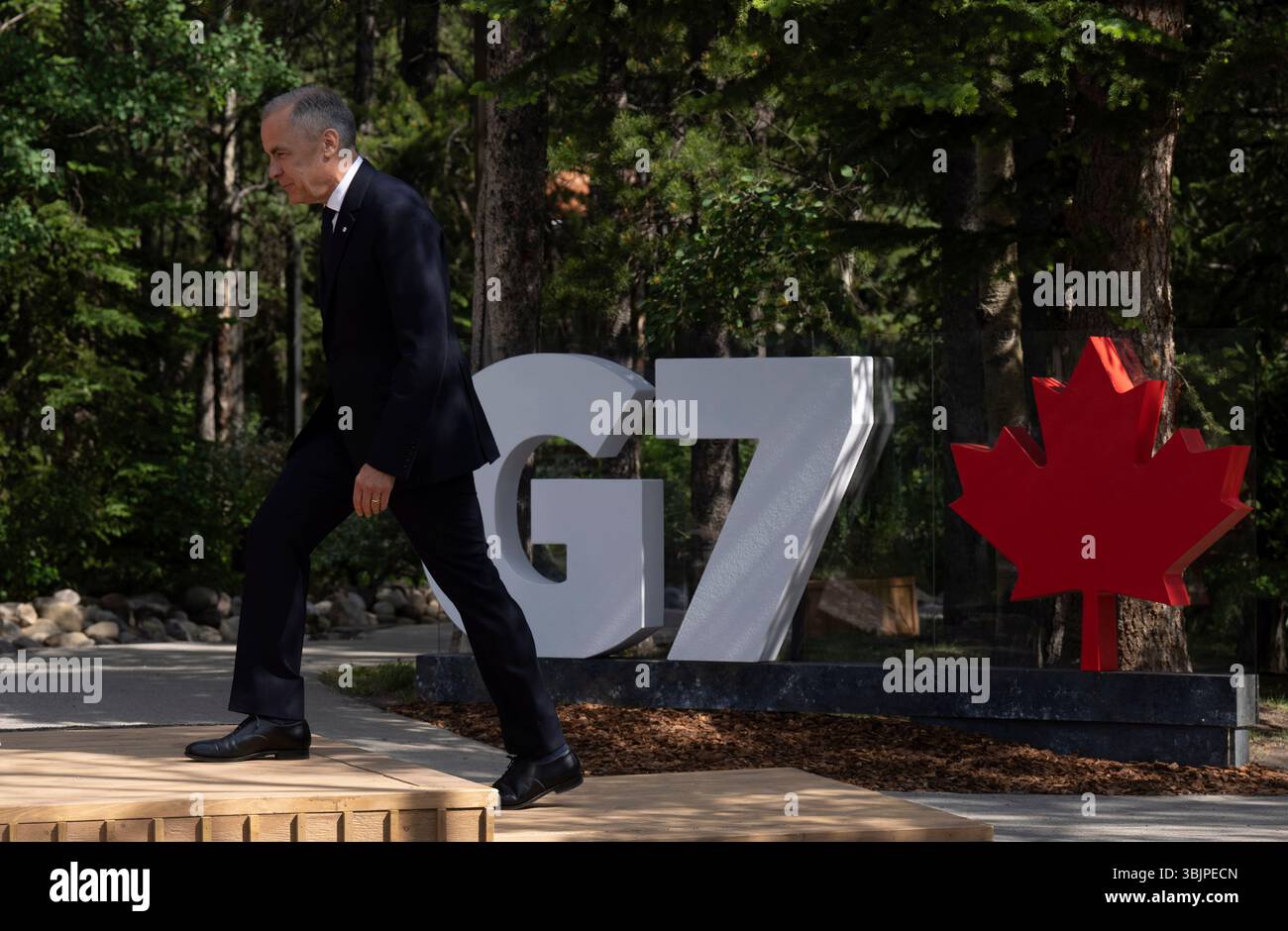 Canada Prime Minister Mark Carney steps onto the stage to welcome ...