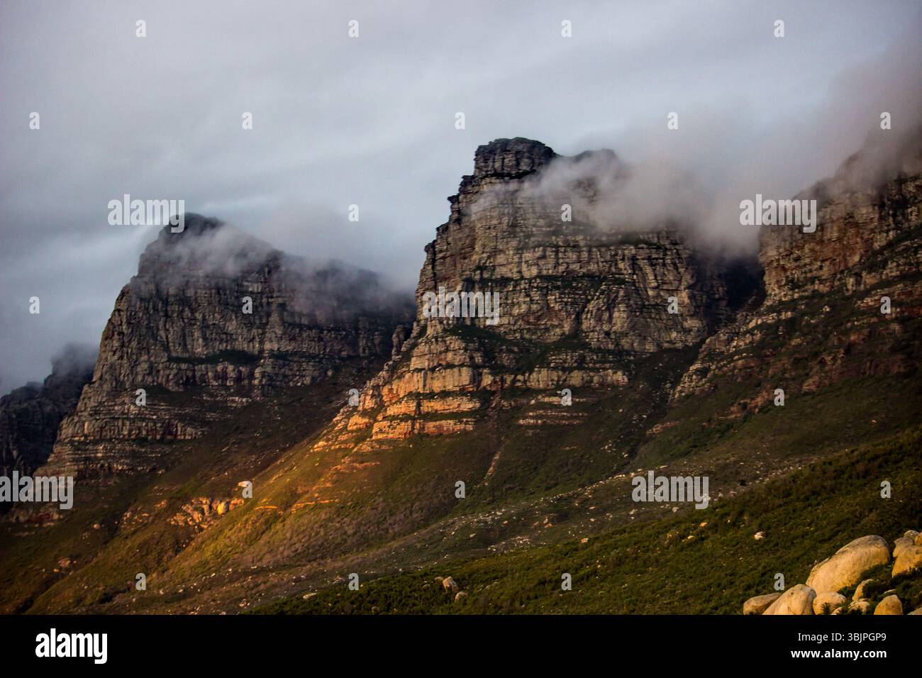 Mist flowing over and in between the majestic peaks of the Twelve ...