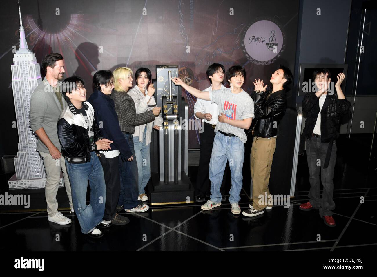 New York, USA. 16th June, 2025. Stray Kids pull the lever to light the ...
