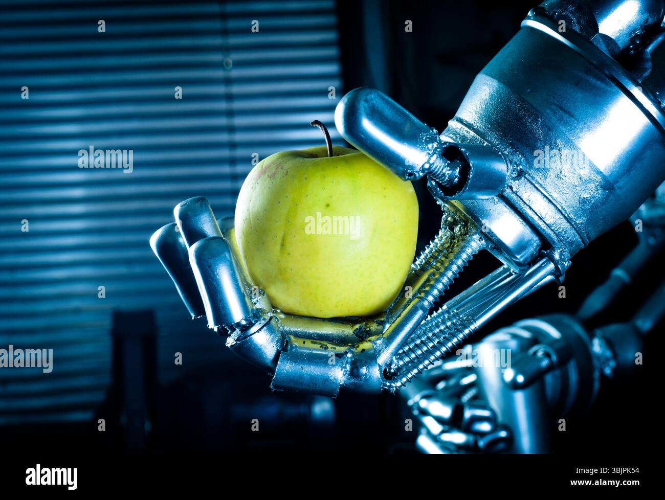 Robot hand holding fresh apple Stock Photo - Alamy