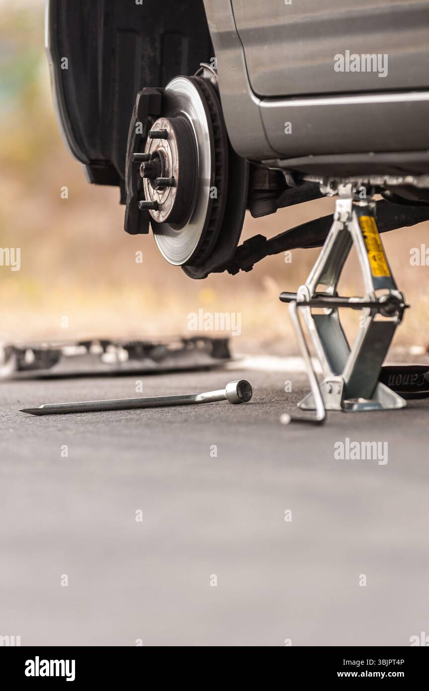 Grey car without wheel hi-res stock photography and images - Alamy
