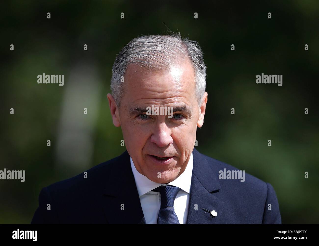 Canadian Prime Minister Mark Carney looks on while welcoming world ...