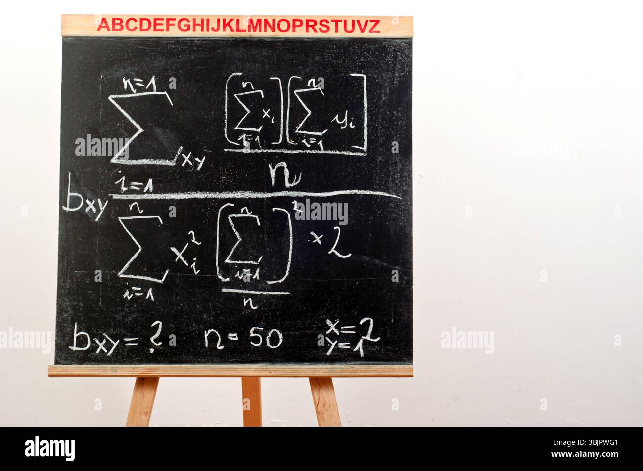 Black chalkboard with formula against white background Stock Photo - Alamy