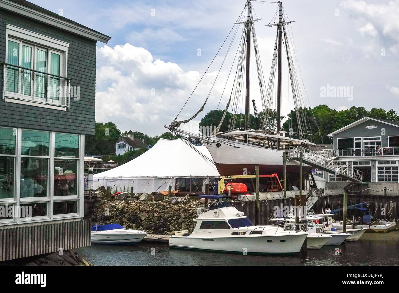 Boats along the Kennebunk River including the Spirit of Massachusetts ...