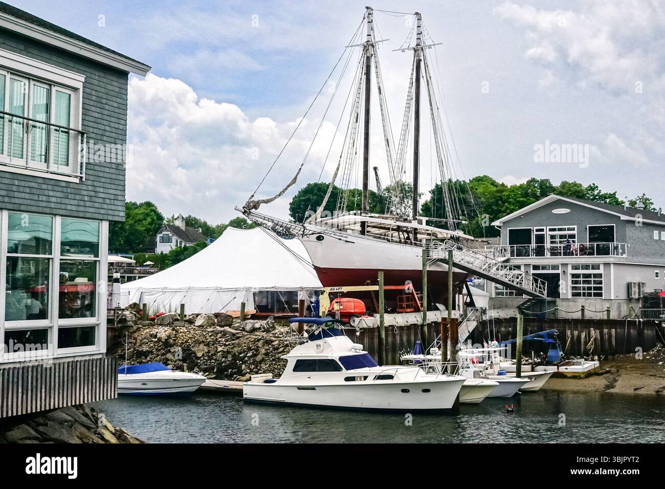 Boats along the Kennebunk River including the Spirit of Massachusetts ...