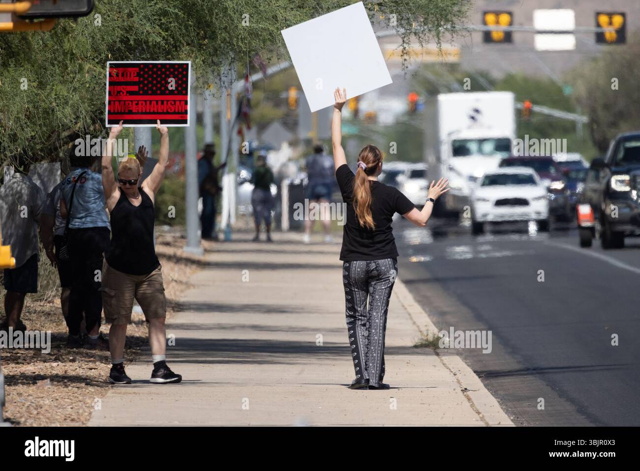 Protesters in Tucson, Arizona, rally on No King’s Day with signs ...