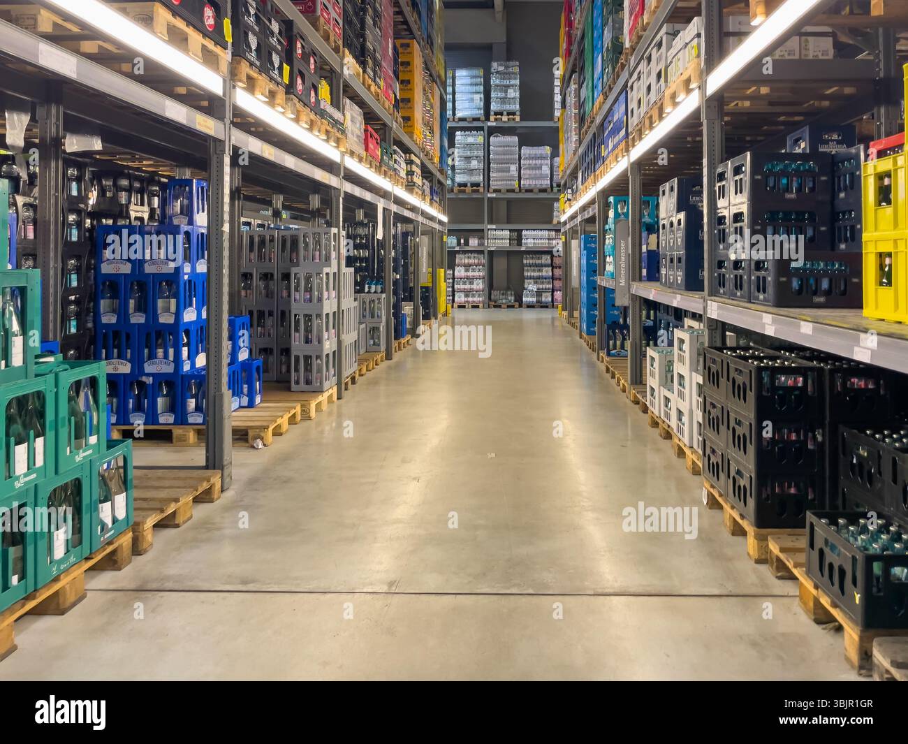 Germany Berlin June 7, 2025. A large beverage aisle filled with crates ...