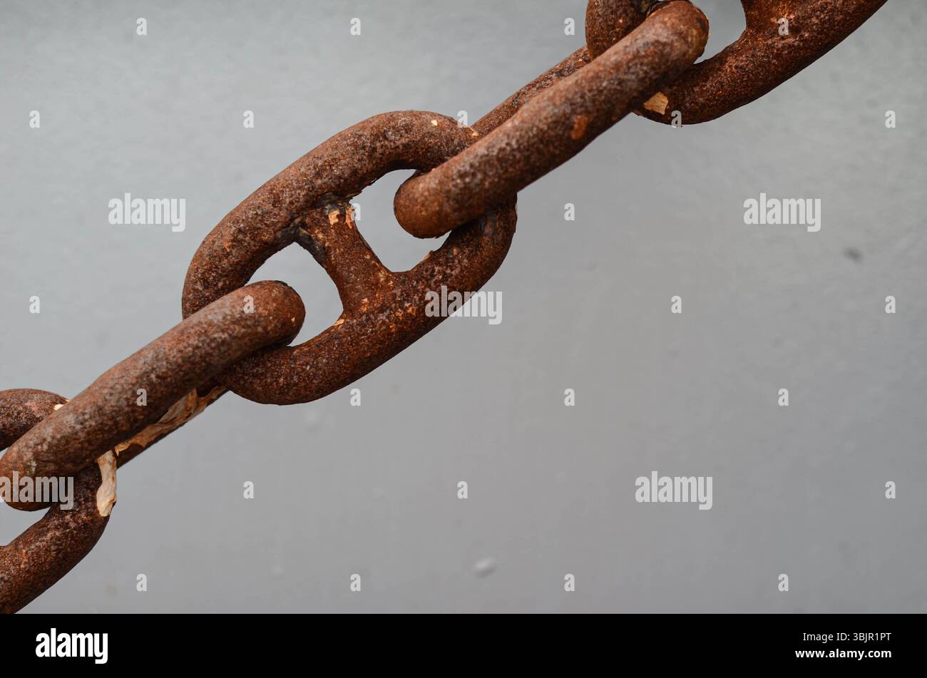 The rusty but fully operational anchor chain on board of offshore ...