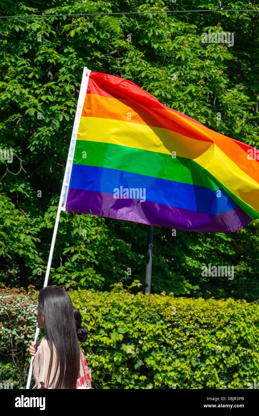 Rainbow flag waving at the Warsaw Equality Parade in Warsaw, Masovian ...