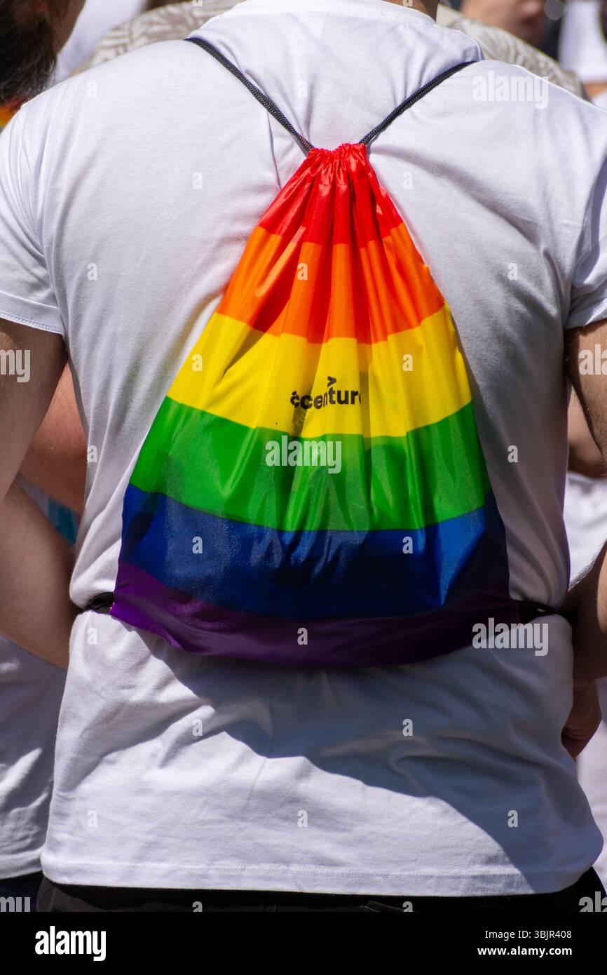A participant wearing a rainbow-striped backpack at the Warsaw Pride ...