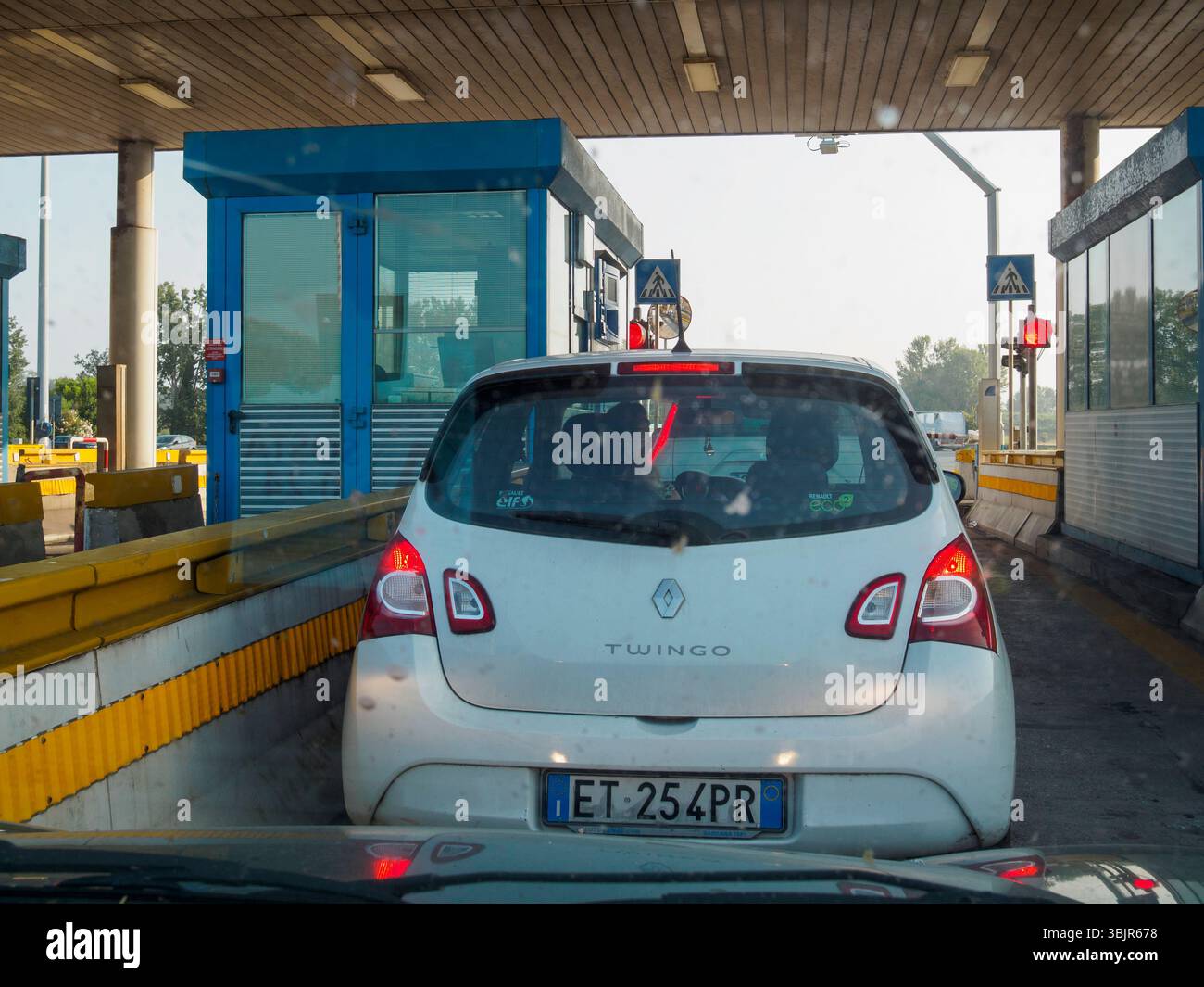 Cisanello, PI, Italy -June 13th 2025 white hatchback car passing ...