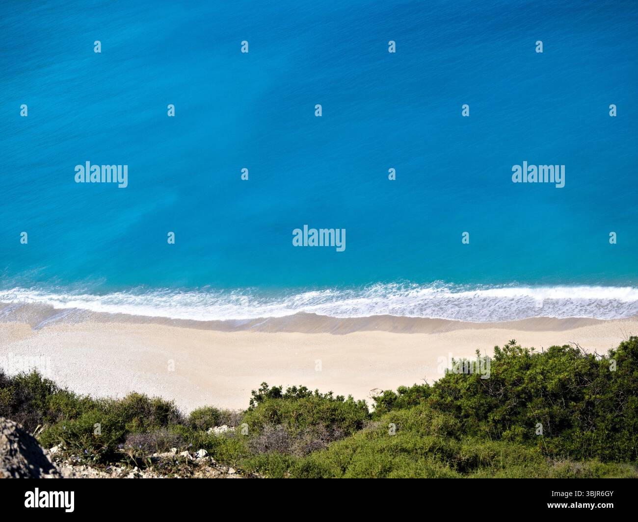 Top-down view of Myrtos Beach in Kefalonia, Greece showing deep blue ...