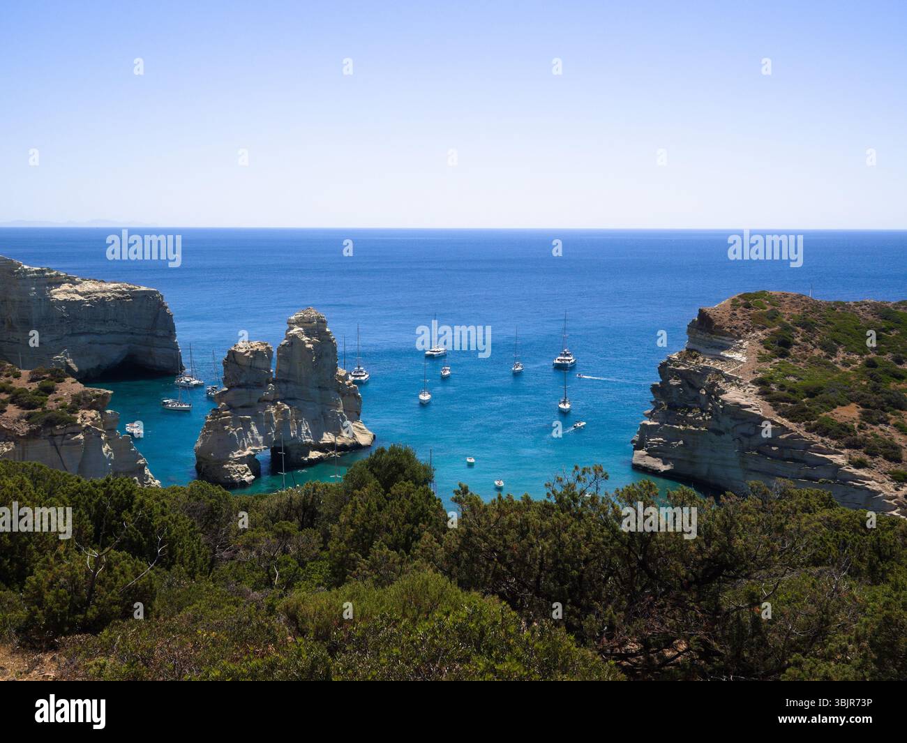 Panoramic image of Kleftiko bay with limestone cliffs, lush coastal ...