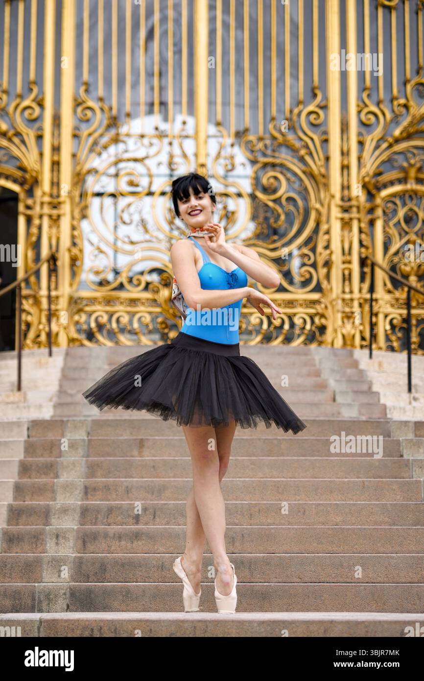 Elegant ballerina posing in front of golden gate in Paris Stock Photo ...