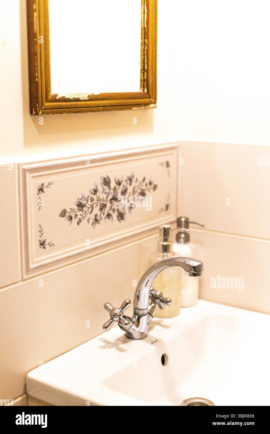 faucet and washbasin in a bright Provence style bathroom and a vintage ...
