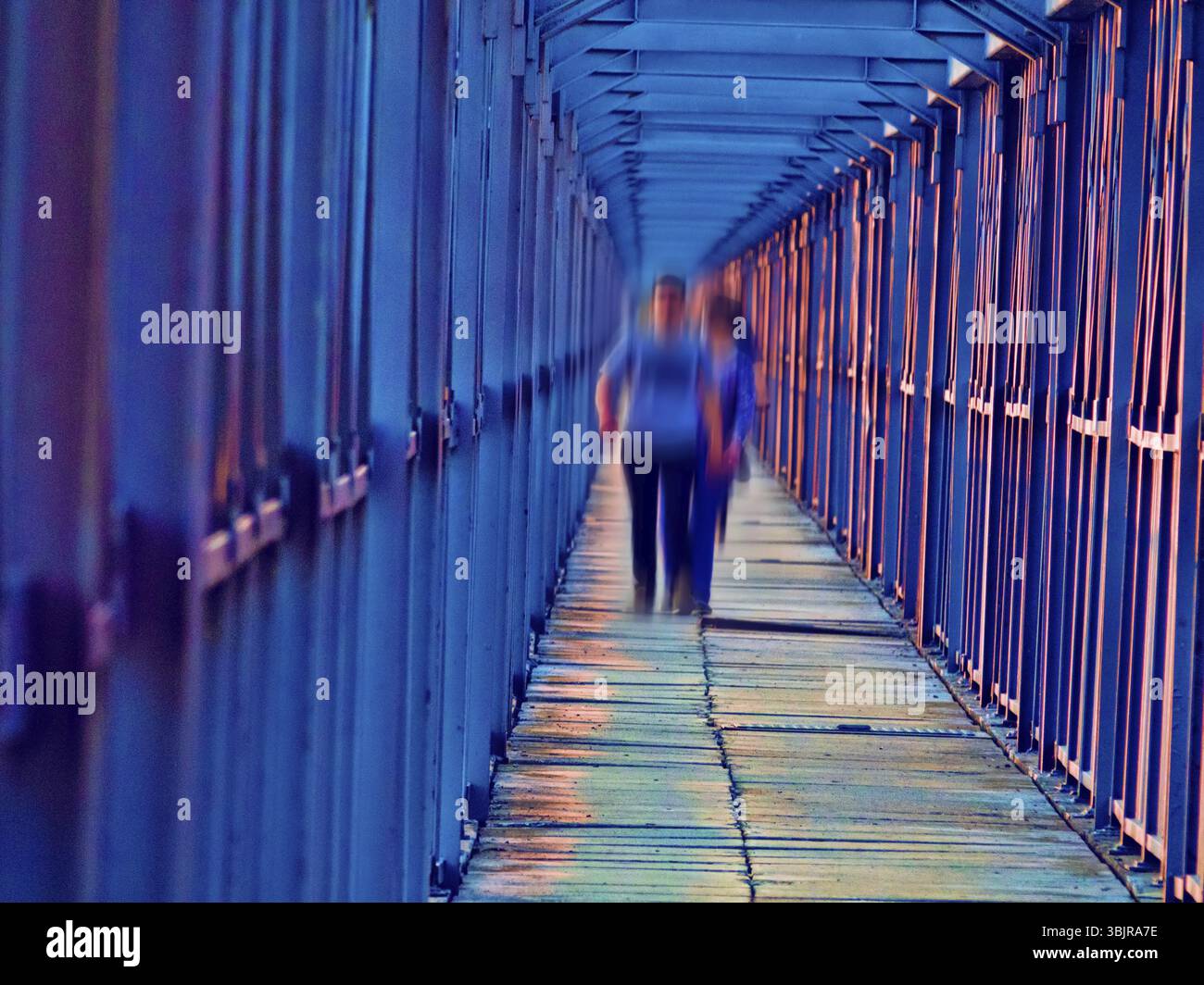 Bridge crossing, pedestrian overpass made of metal structures over the river along the railway ...