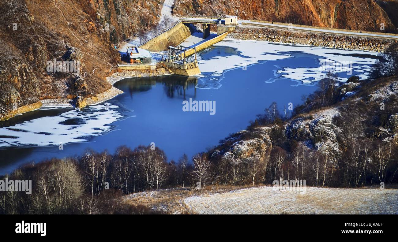 Reservoir, dammed body of water, partially frozen in the gorge for ...
