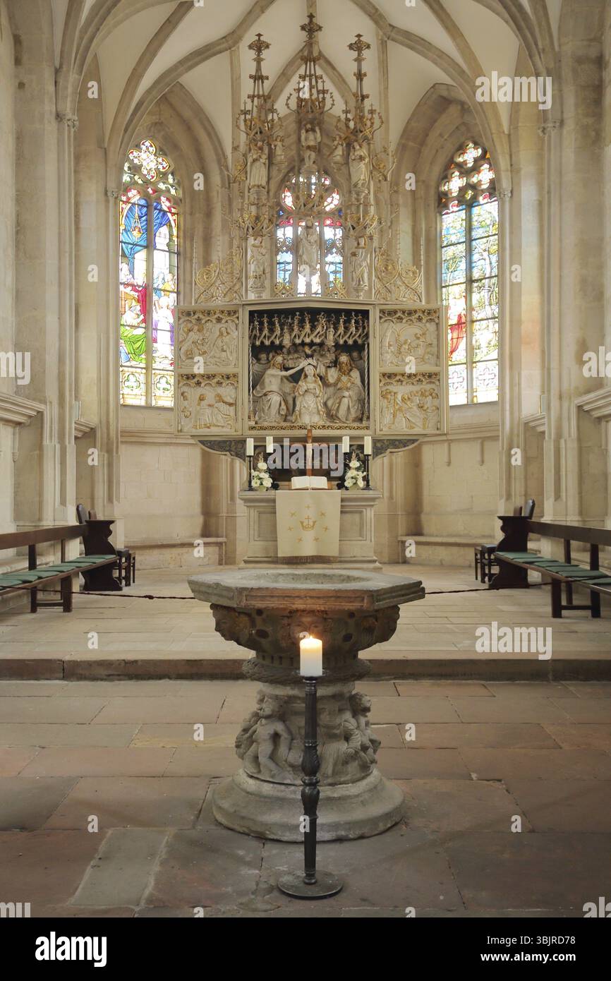 High altar and baptismal font of the Romanesque St. Mary's Church ...